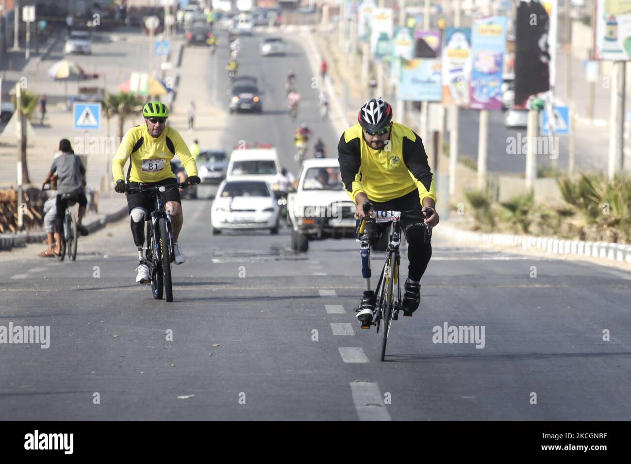 Palestinian Cyclist Alaa Al Dali (right) ride his bicycle during a ...