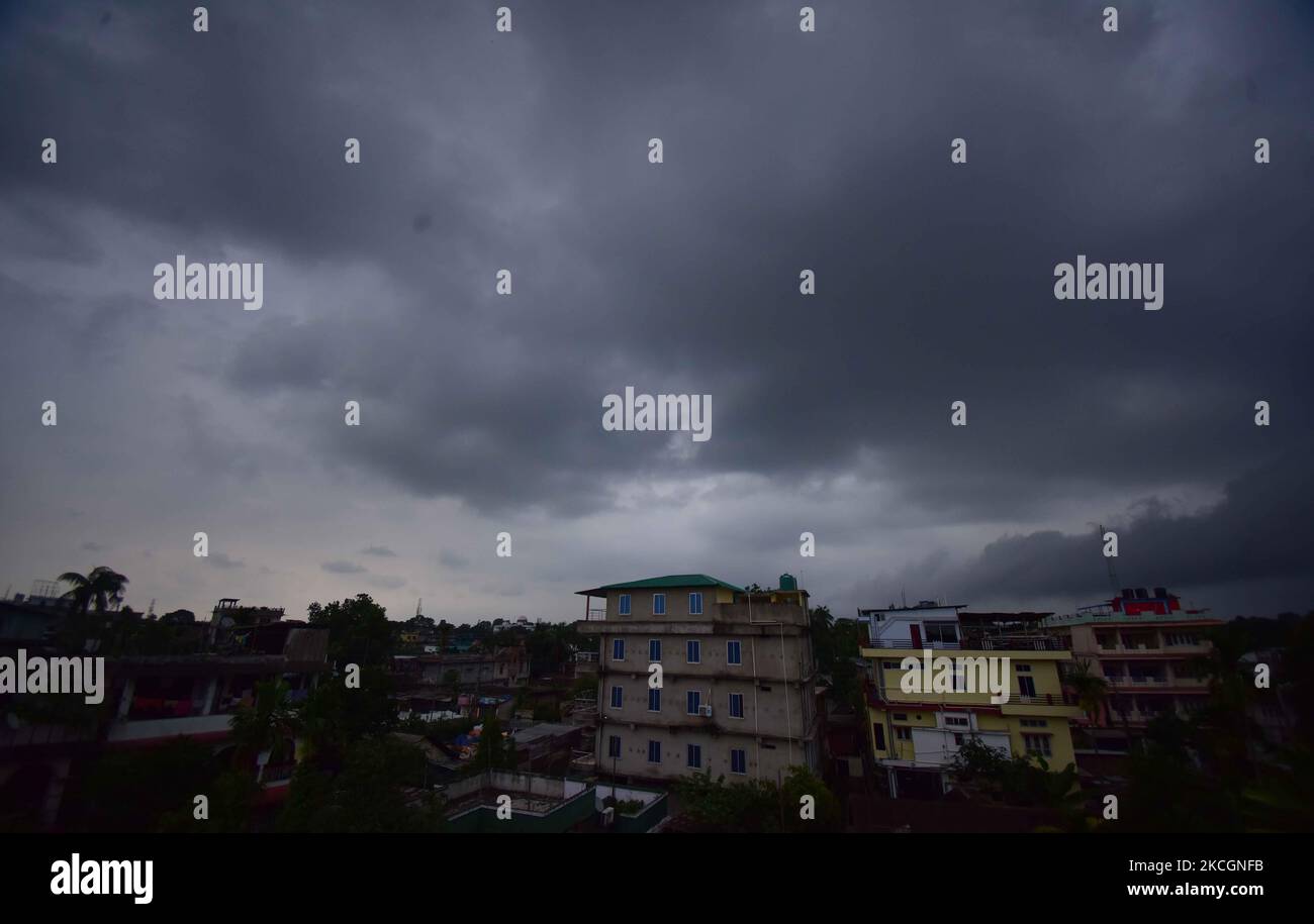 Dark clouds loom in the sky ahead of heavy rain, in Nagaon District of ...