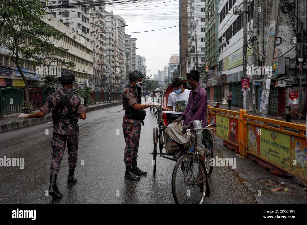 Border Guard Bangladesh are inquiring mass people at a checkpoint in ...