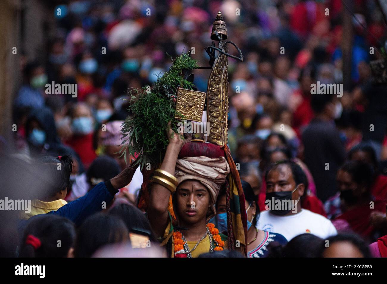 A man attired as deity parades on the last day of the Navadurga dance ...