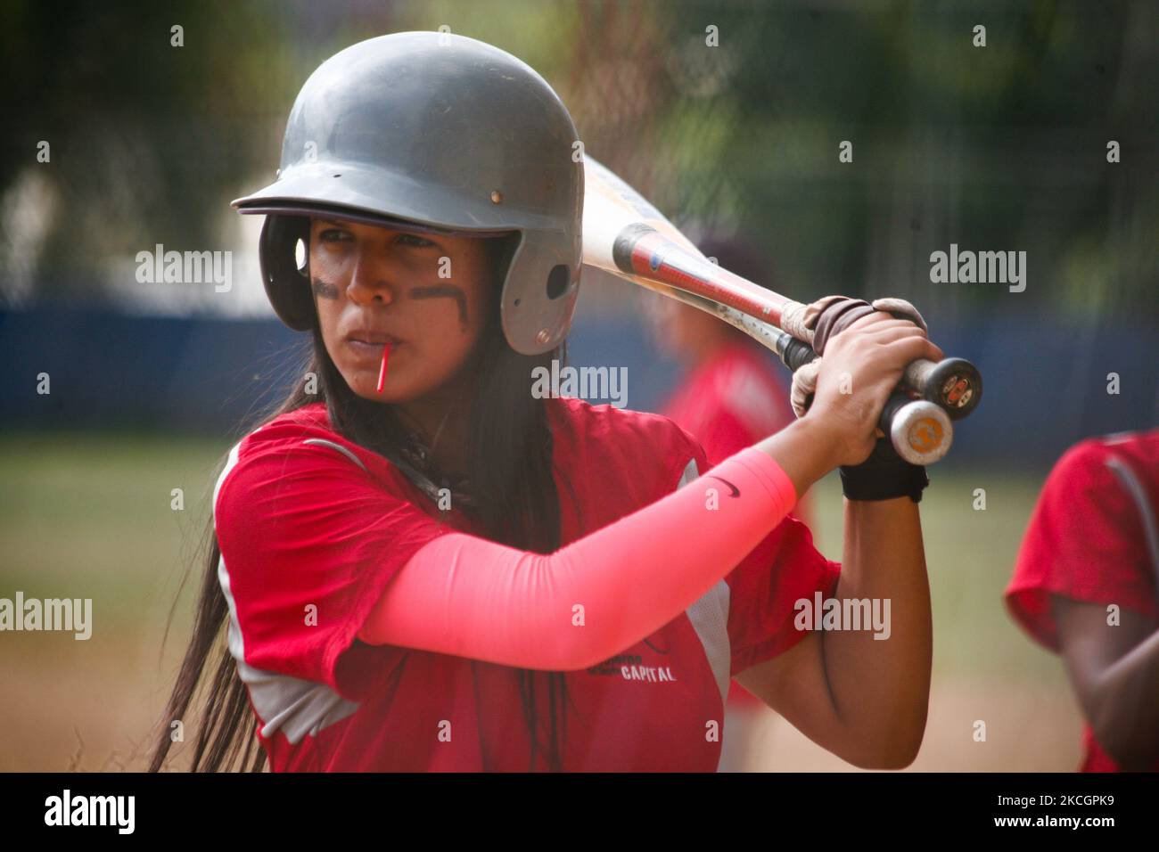 Girl baseball bat helmet hi-res stock photography and images - Alamy