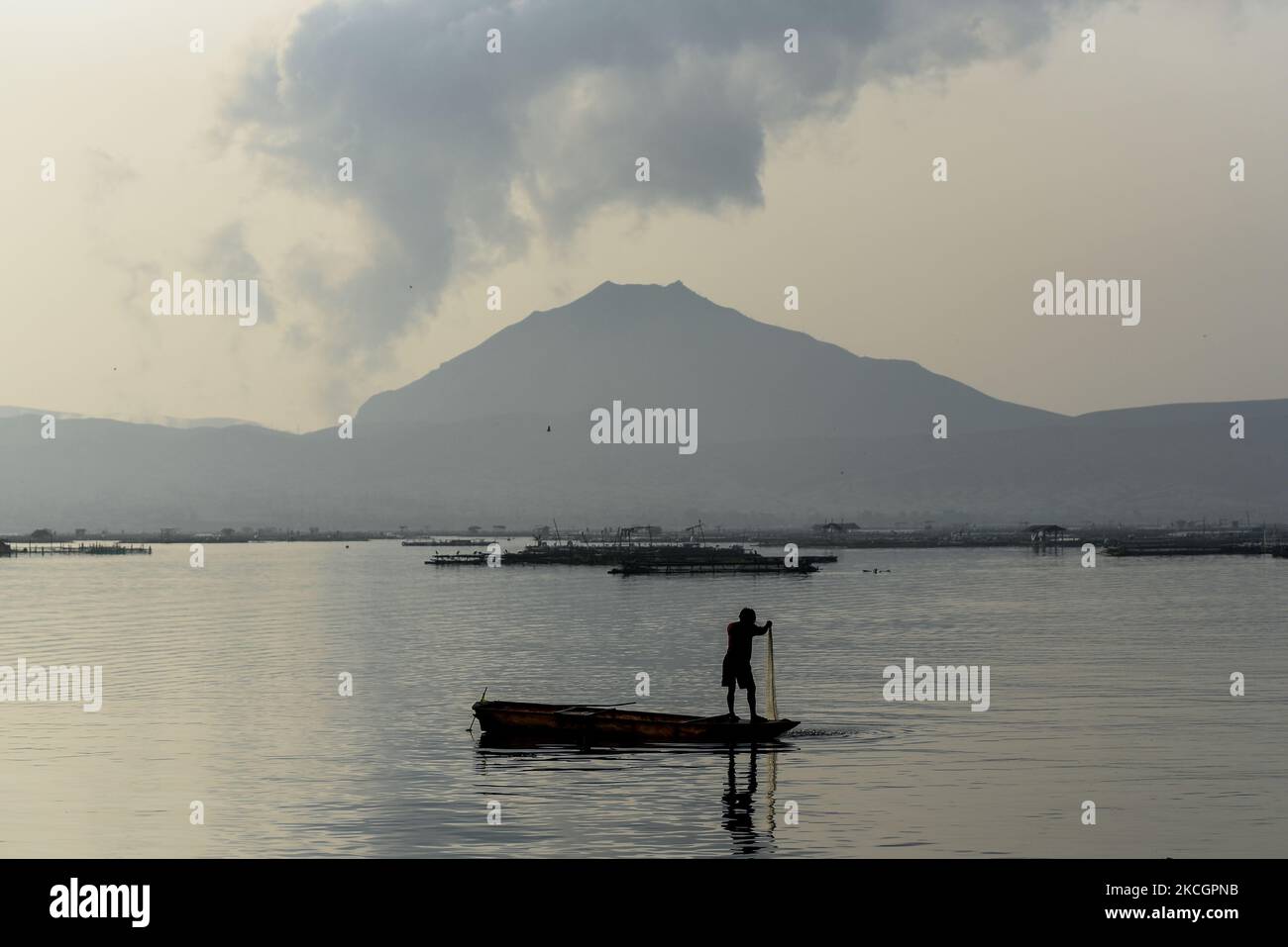 A fisherman resumes fishing in Taal Lake in Agoncillo, Batangas ...