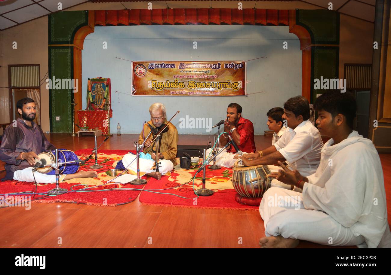 Tamil Hindu musicians perform traditional Carnatic devotional songs ...