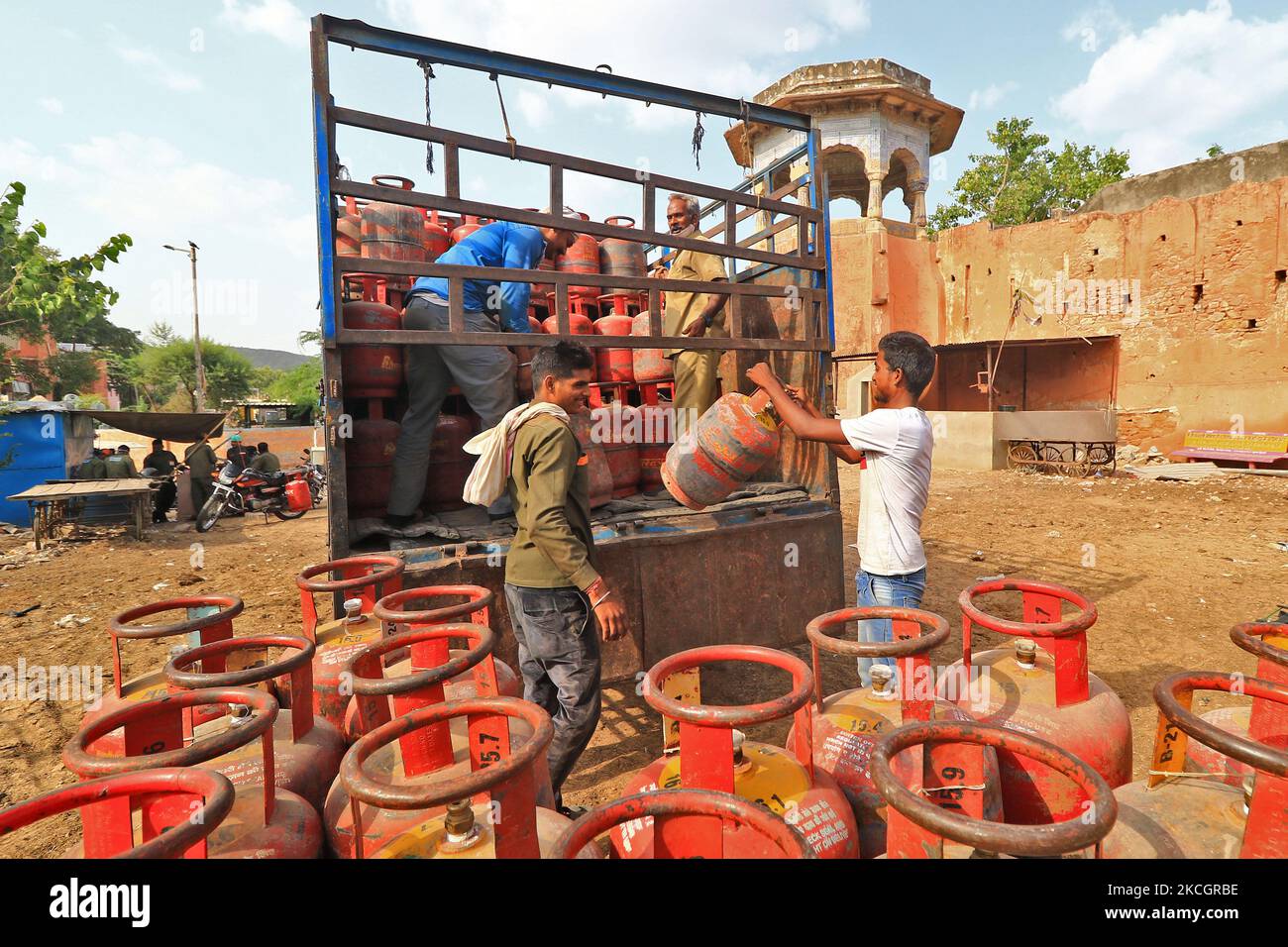 Workers unload lpg gas cylinders hi-res stock photography and images ...