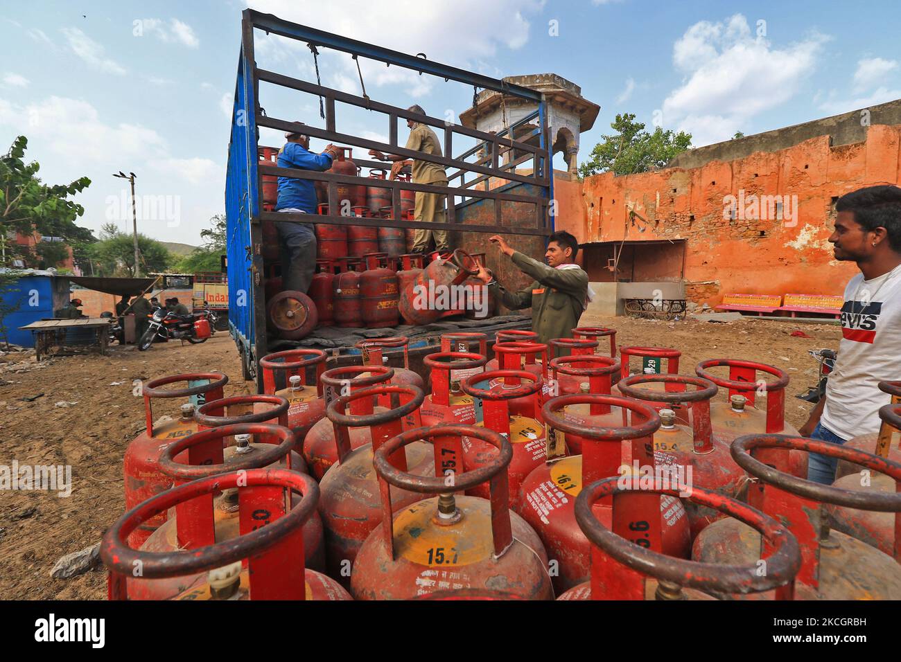 Workers unload lpg gas cylinders hi-res stock photography and images ...