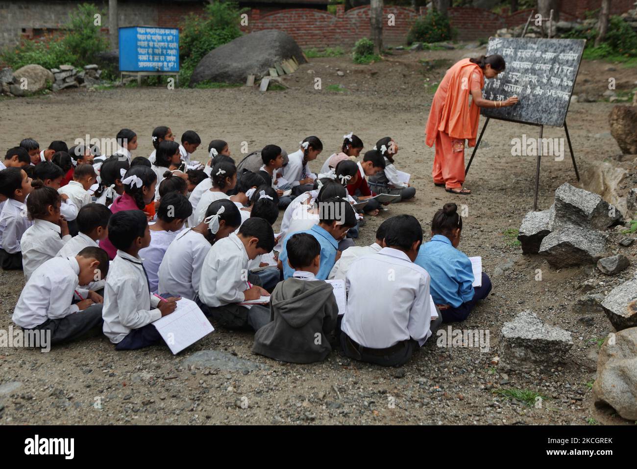 Primary students learn Hindi at an outdoor classroom in the small ...