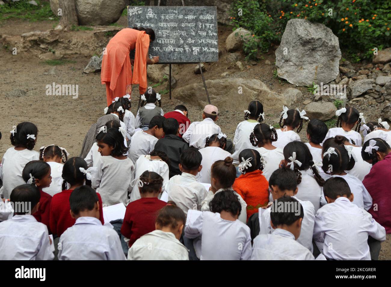 Primary students learn Hindi at an outdoor classroom in the small ...