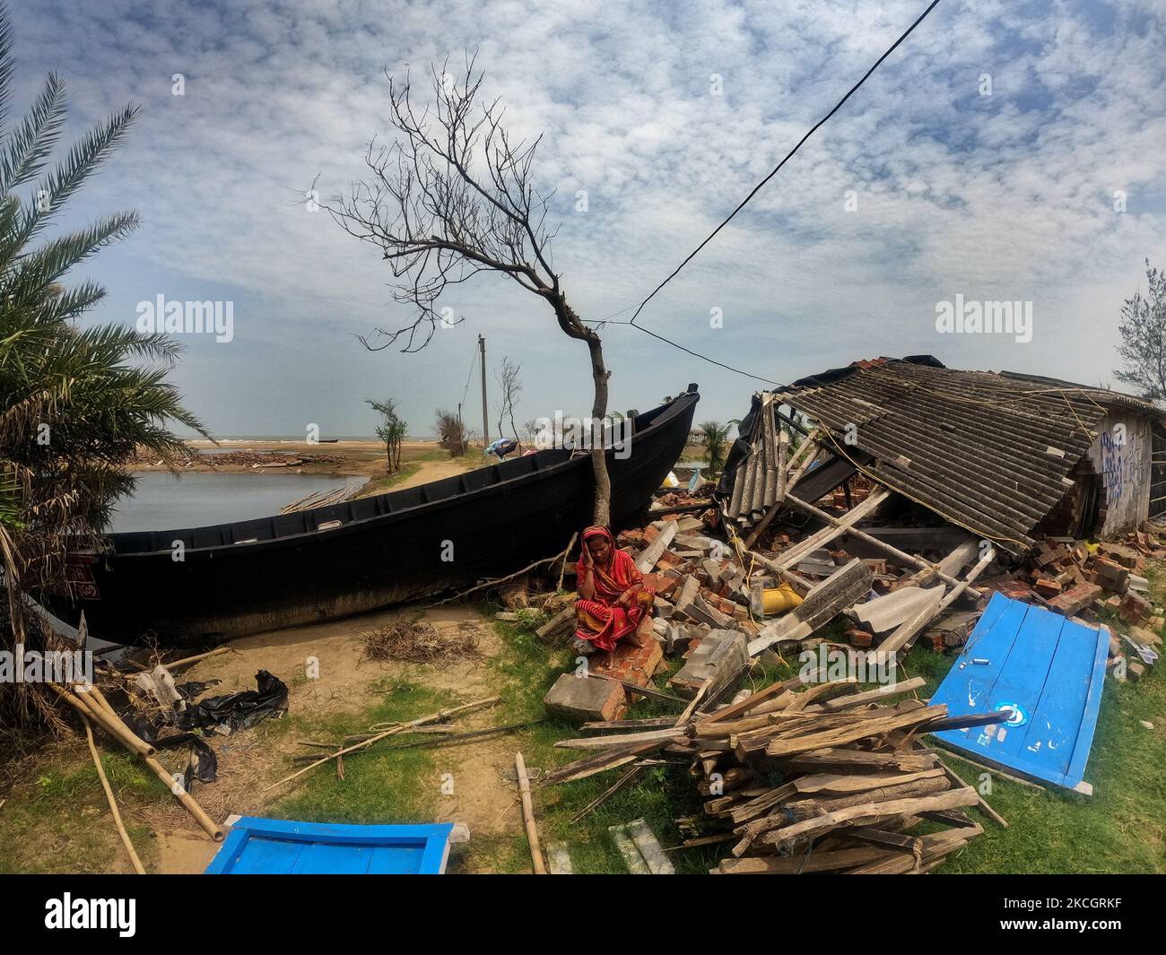 A woman in front of her destroyed house caused by the cyclone. She lost ...