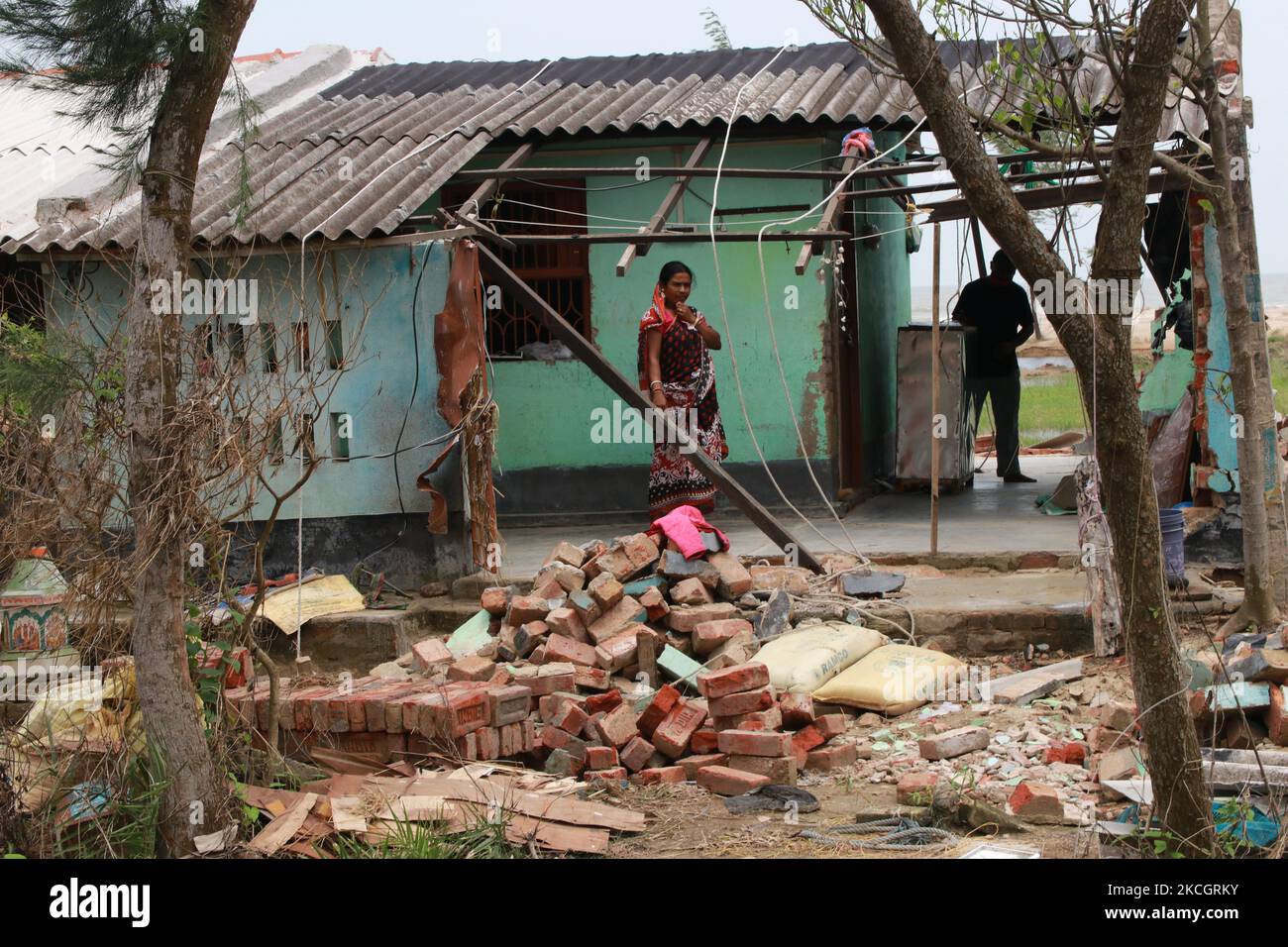 A woman in front of her destroyed house caused by the cyclone. She lost ...