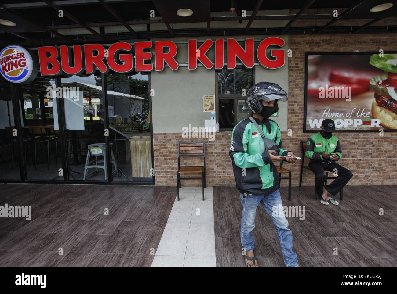 Driver food delivery service Gojek waiting order food for takeaway from ...