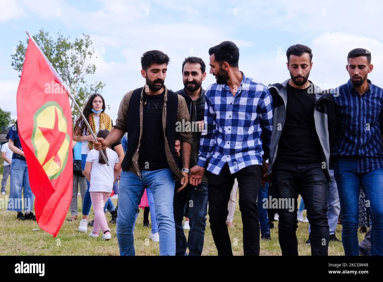A dancer waves the PKK flag and dances during the Rojbin festival in ...