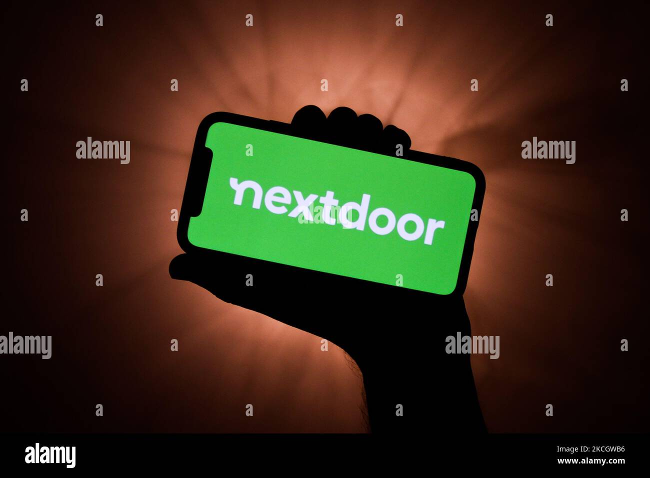 Nextdoor logo is seen displayed on a phone screen in this illustration ...