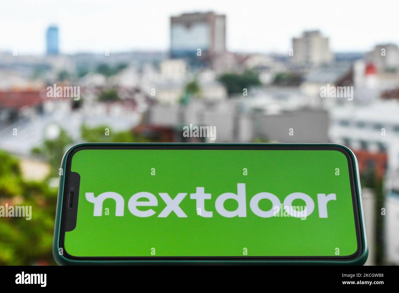 Nextdoor logo is seen displayed on a phone screen in this illustration ...