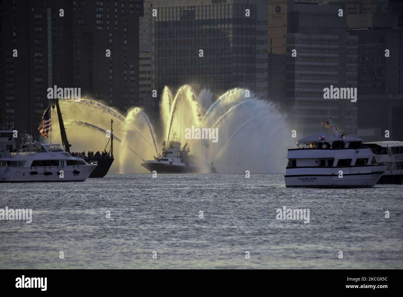 Boats spray water in the colors of the flag in the East River at the ...
