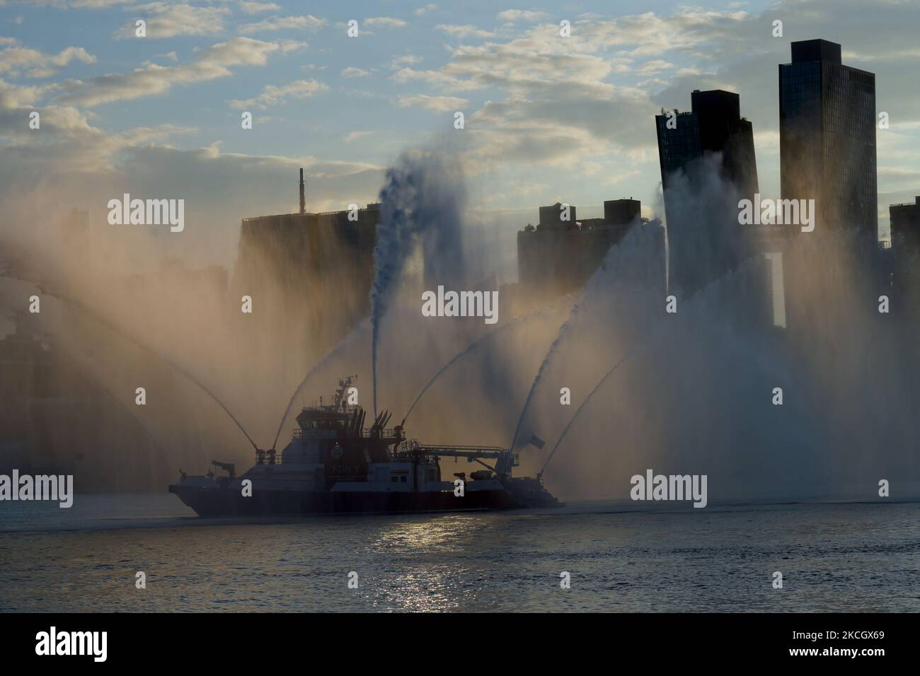 Boats spray water in the colors of the flag in the East River at the ...