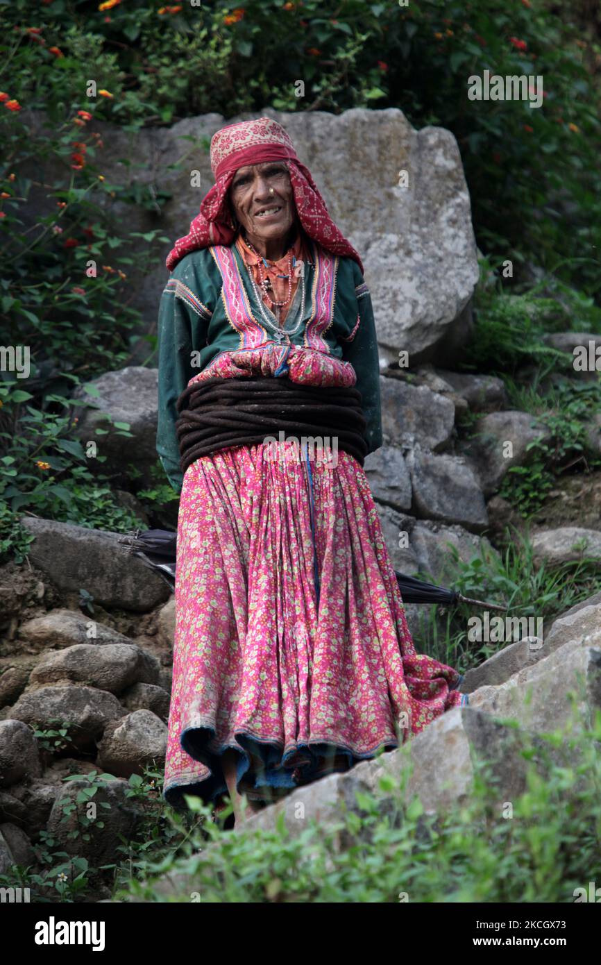 Elderly Gaddi woman wearing traditional clothing in a remote mountain ...