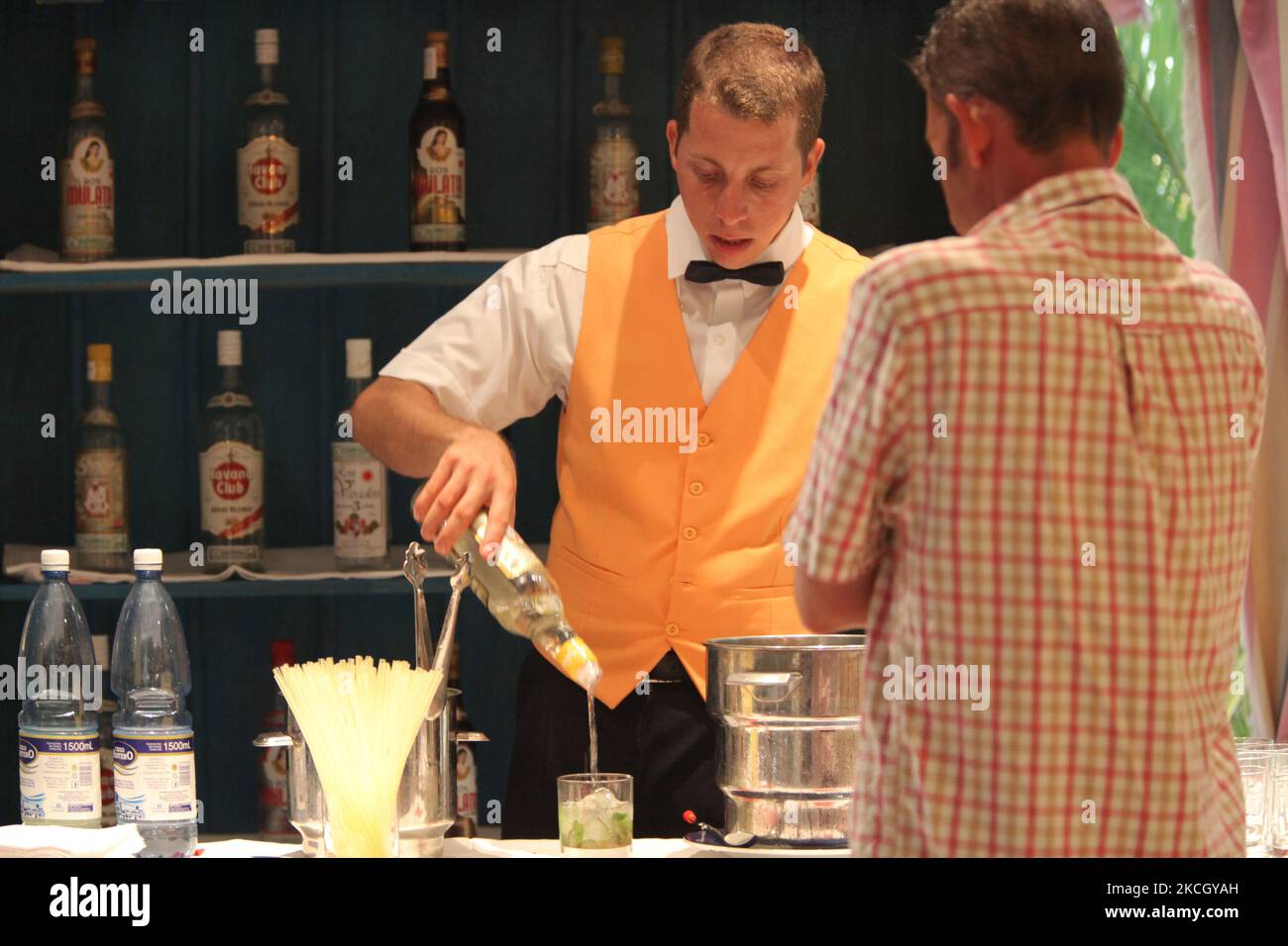 Cuban bartender mixes Cuba's national drink (the mojito) at a bar in ...