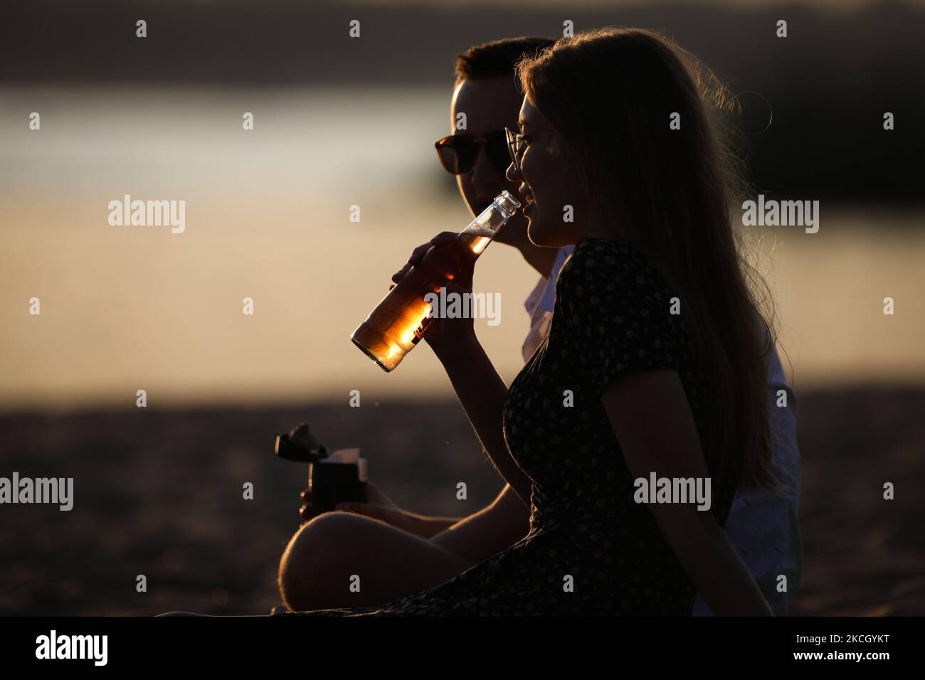People are seen enjoying the warm weather at at a beach on the Vistula ...