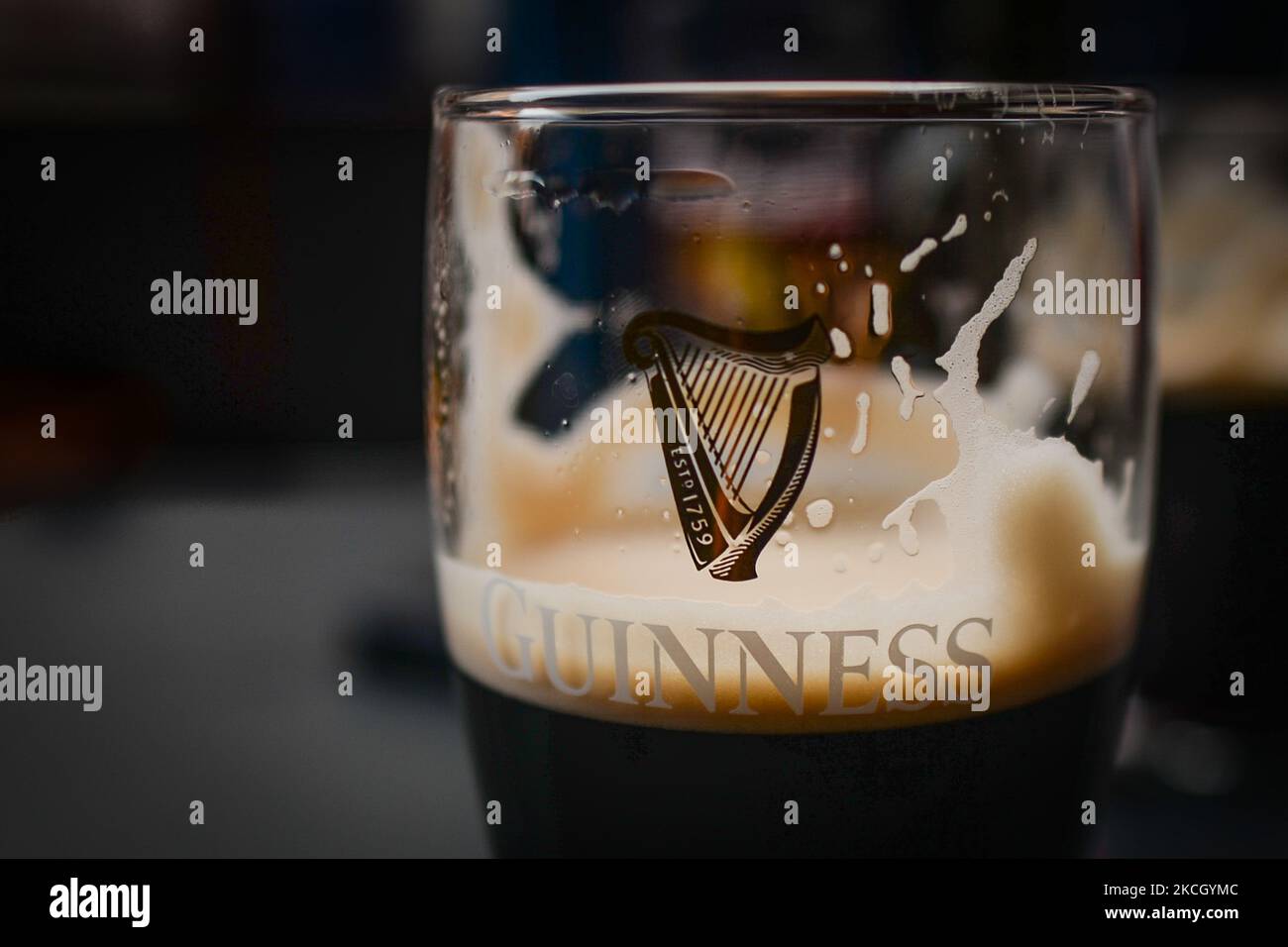 A pint of Guinness on the table outside a pub in Dublin city center. On ...