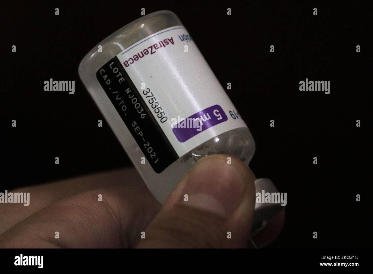 Medical personnel load syringes with the first dose of the AstraZeneca ...