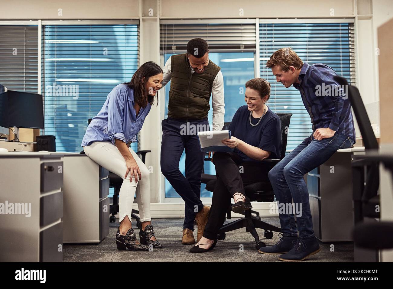 Collaborating on a big design. a group of designers brainstorming ...