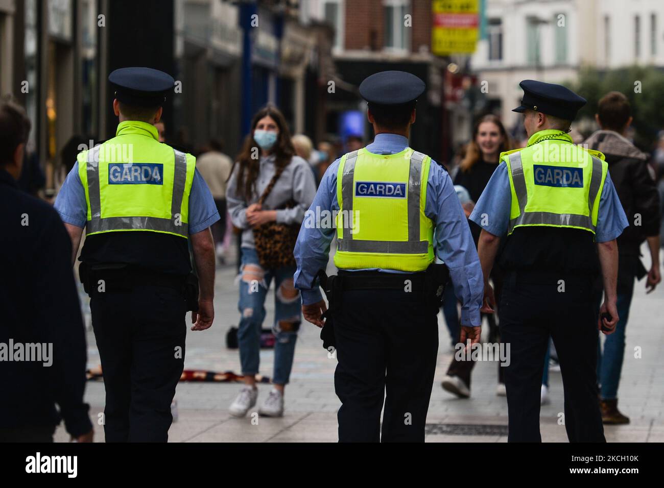 Three Garda officers seen in a busy Grafton Street in Dublin city ...