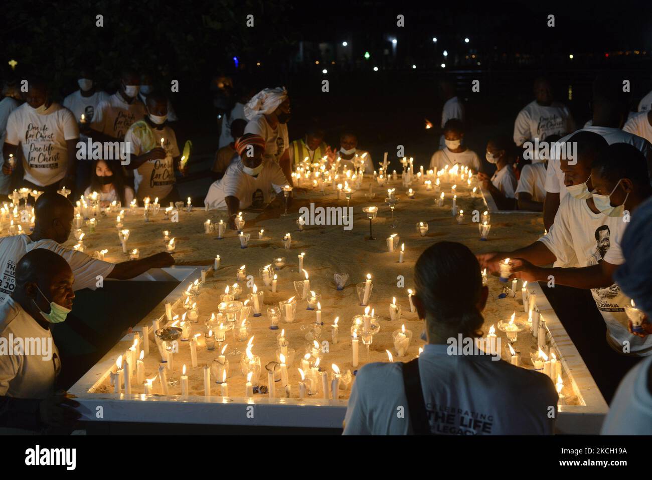 Members of Synagogue Church of All Nations (SCOAN) hold a candlelight ...