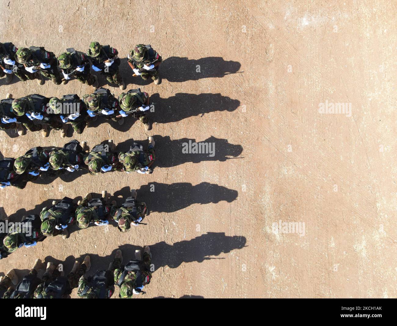 Syrian fighters march in columns, ride dirt bikes and and drive pick-up ...