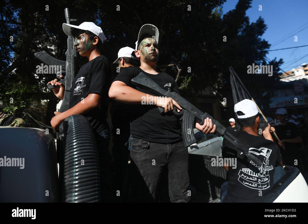 Palestinians youths take part in a military summer camp organized by ...