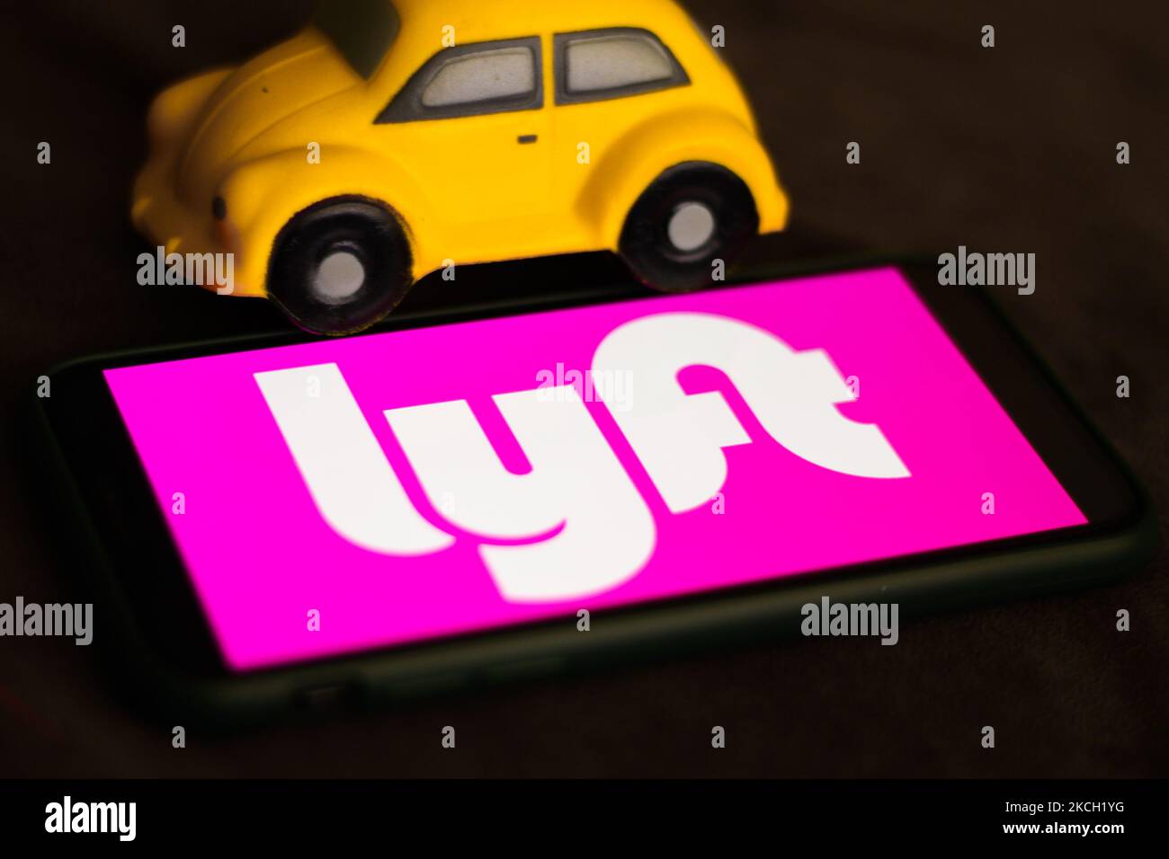 Lyft logo displayed on a phone screen is seen in this illustration ...
