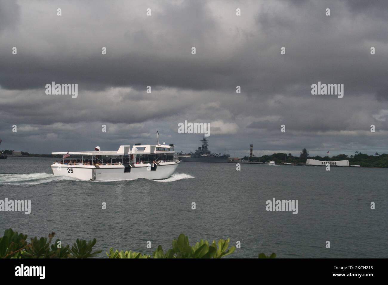 Tourists on a boat headed for the U.S.S. Arizona Memorial at Pearl ...