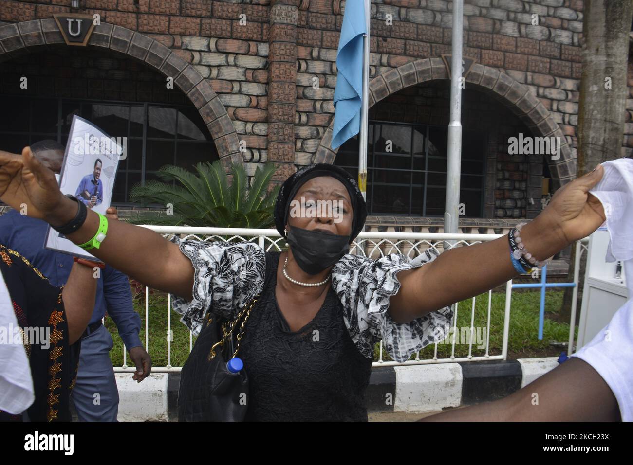 A woman reacts at the Synagogue Church of All Nations (SCOAN), as ...