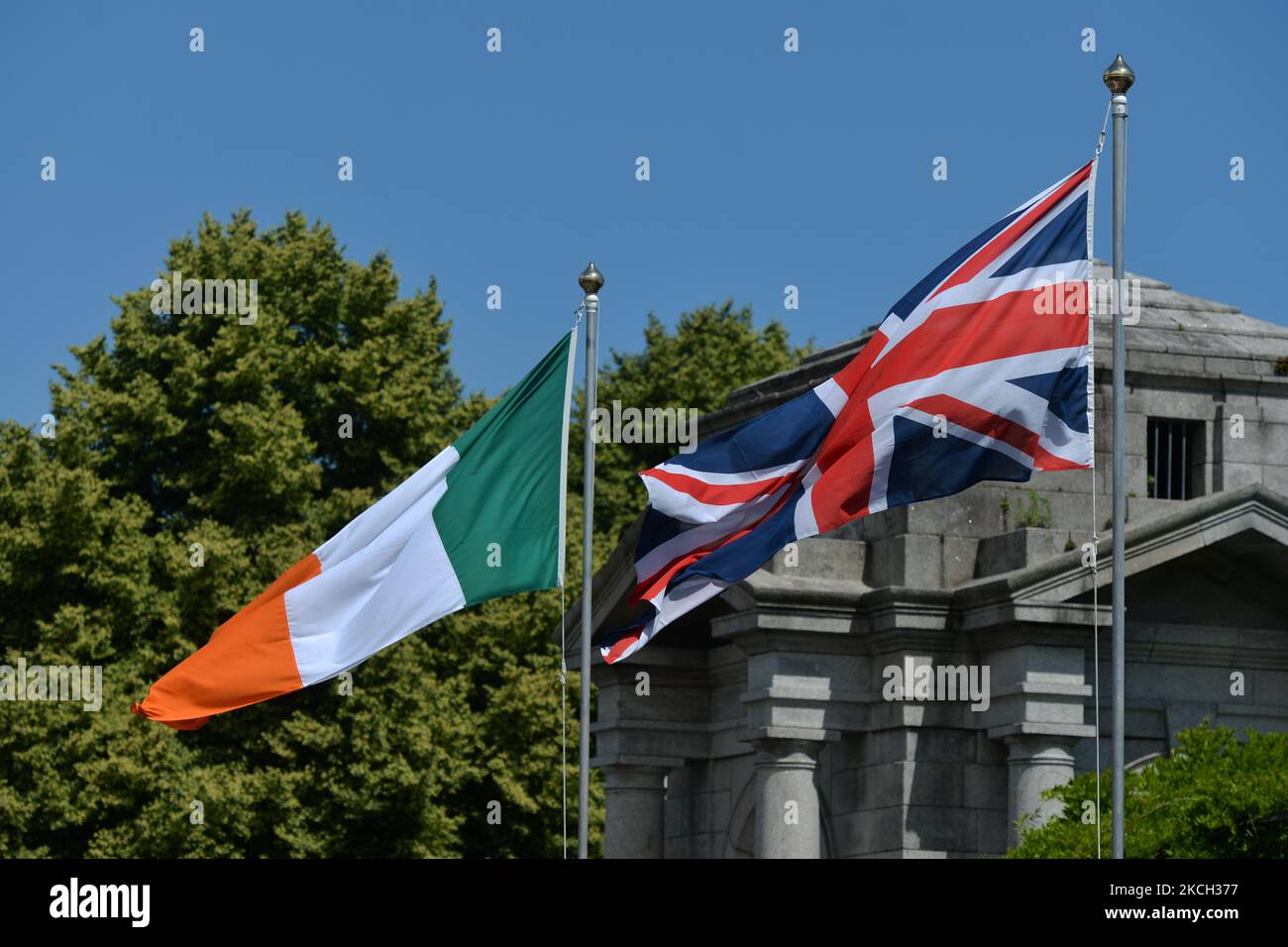 Irish and Union Jack flags seen during a wreath laying ceremony marking ...
