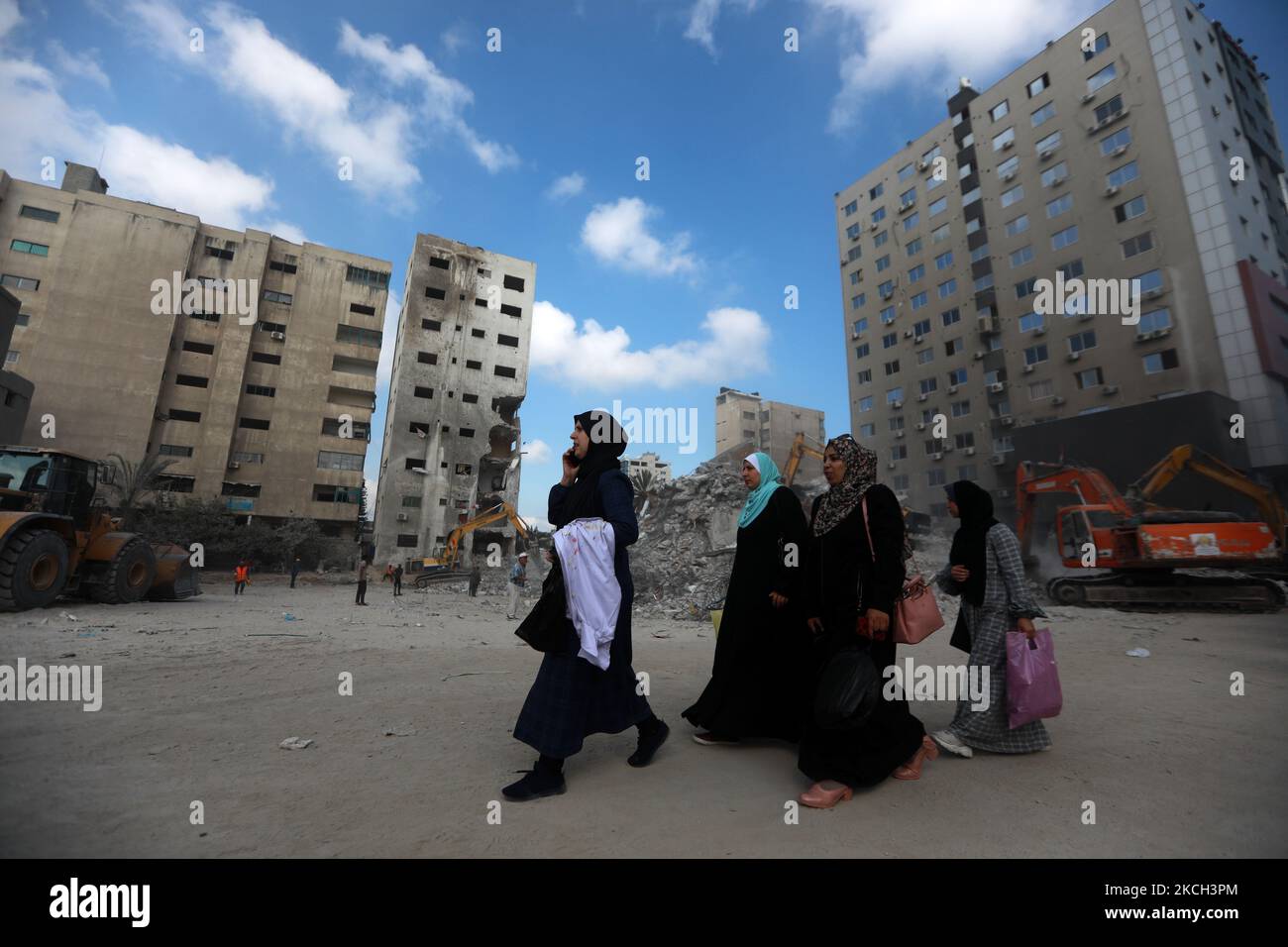Egyptian workers and machines clear the remaining rubble of Al-Jalaa ...