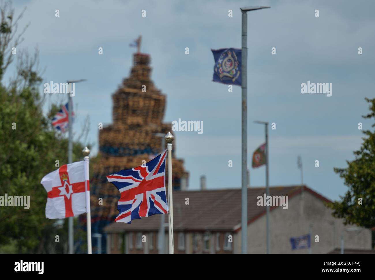 The Union Jack and the Ulster flag seen near a bonfire in Kilcooley ...