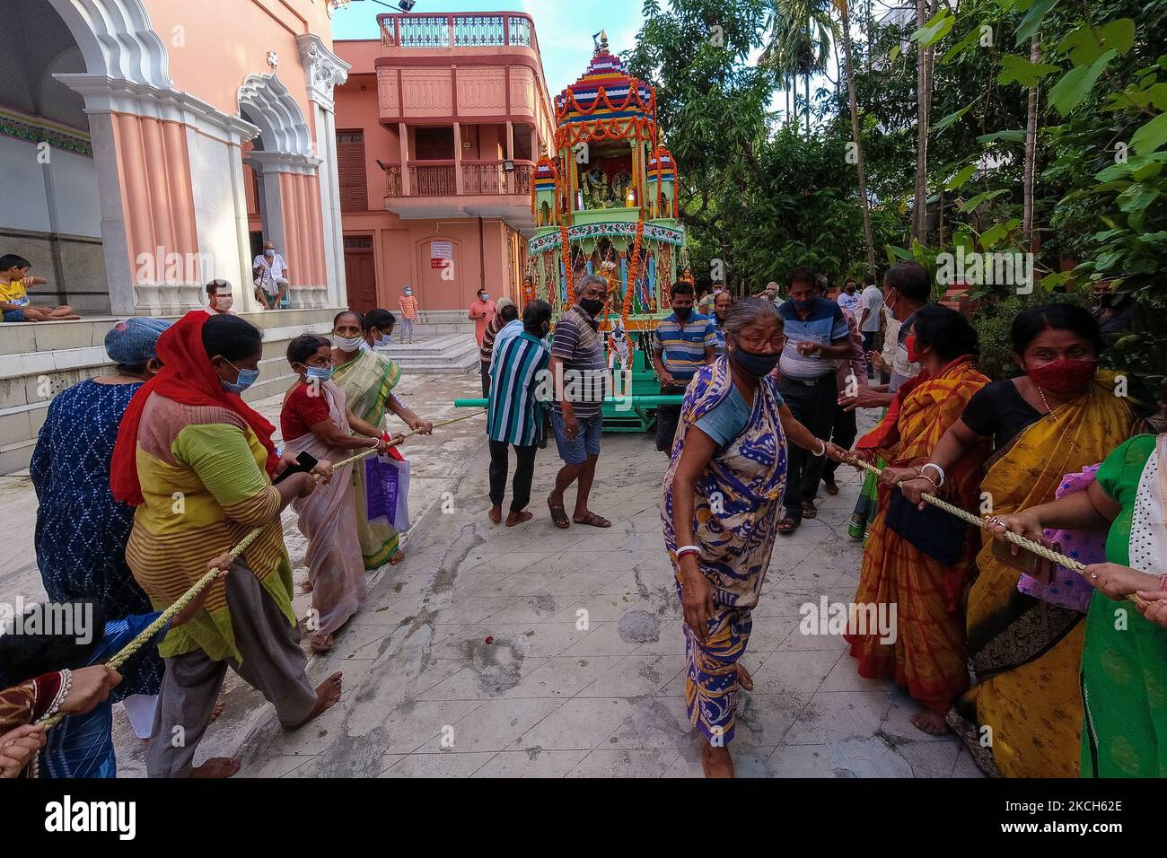 People dragging the chariot of Lord Jaganath , by pulling the ropes of ...