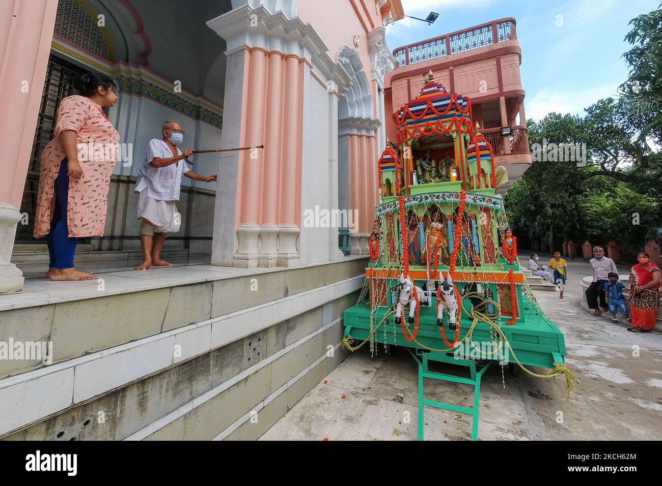 An old man points towards the chariot of Lord Jaganath , inside a ...
