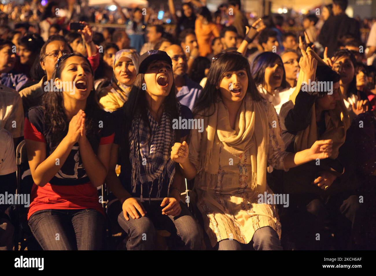 Young Pakistani fans scream in delight as the Pakistani rock band Jal ...