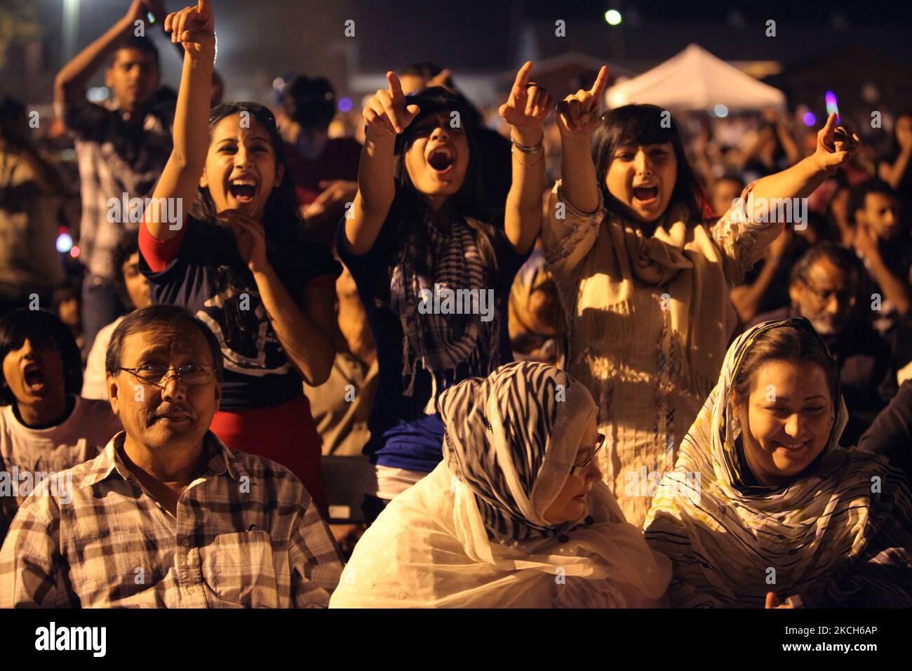Young Pakistani fans scream in delight as the Pakistani rock band Jal ...