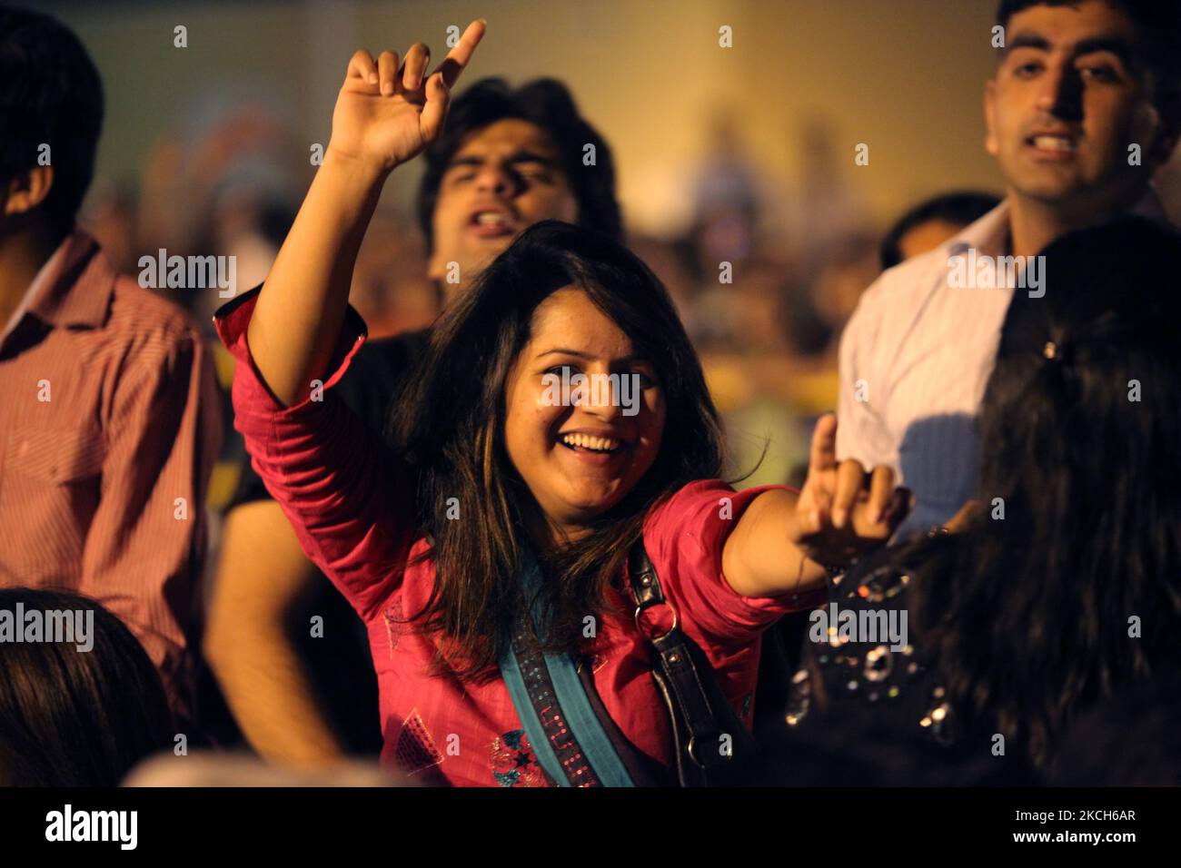 Pakistani woman dances to a song during the performance of the ...