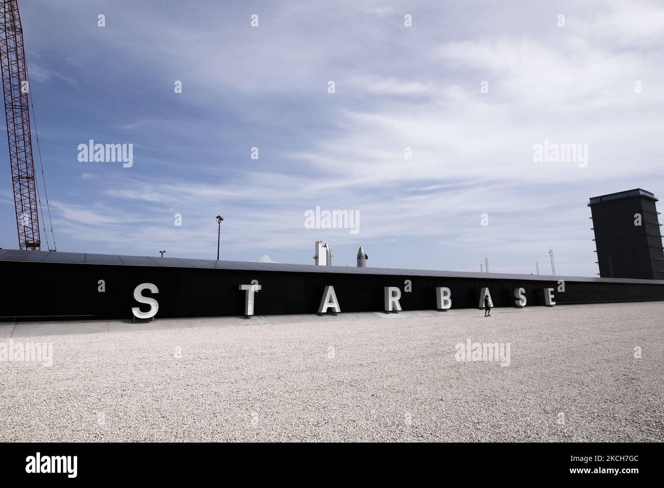 A boy walks past the new Starbase signage in Boca Chica, Texas. July ...