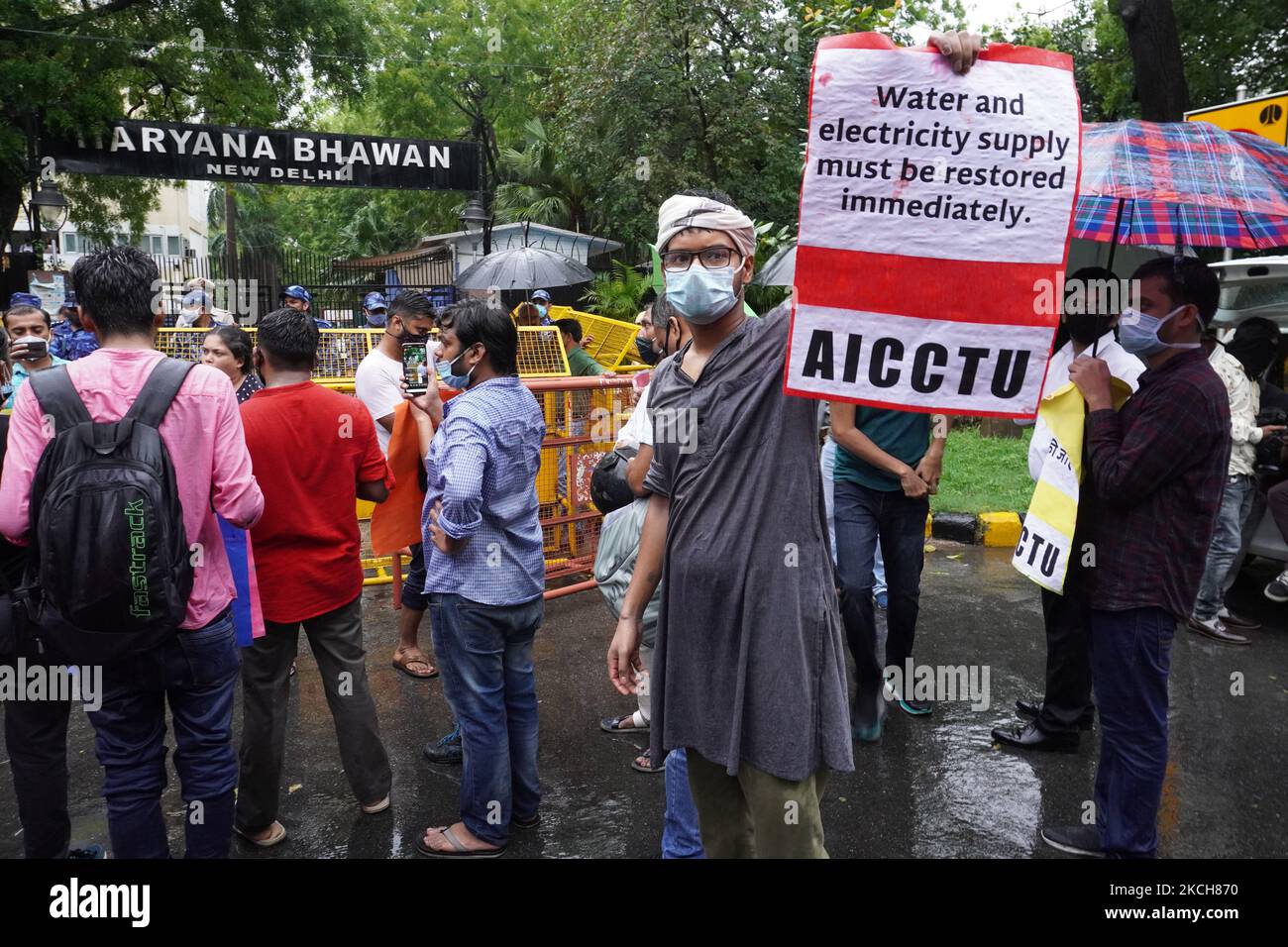 A member of All India Students Association (AISA) shows placard during ...