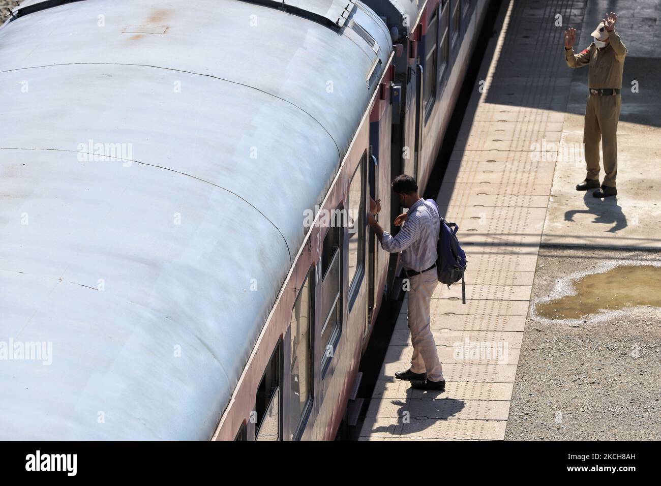 Passengers board a Train from Sopore railway Station in District ...