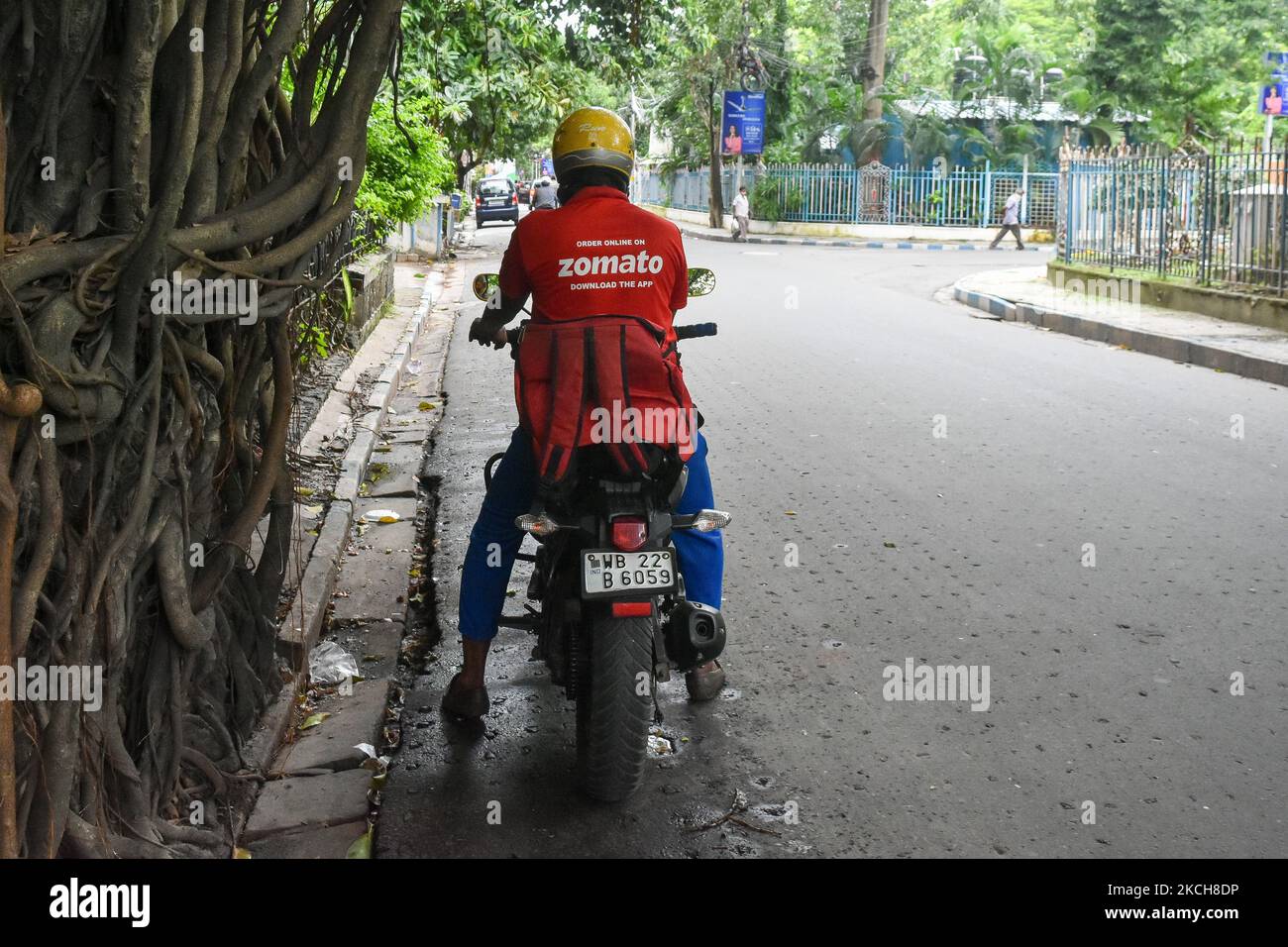 A ZOMATO delivery boy is seen taking a break in between delivery call ...