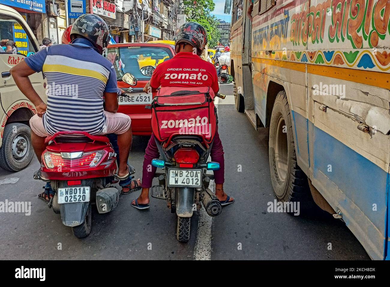 A ZOMATO food delivery partner is seen on a road in Kolkata , India ...