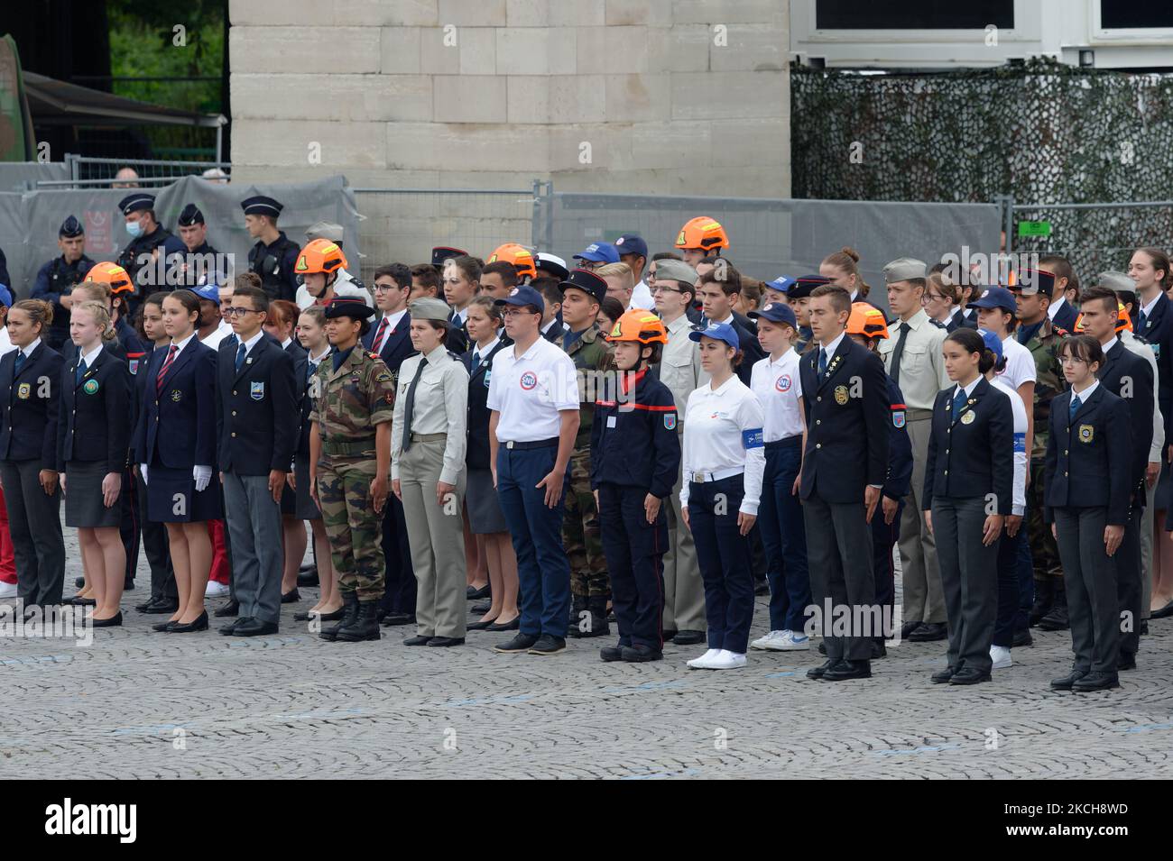 Group of young people in civic services in front of French President ...