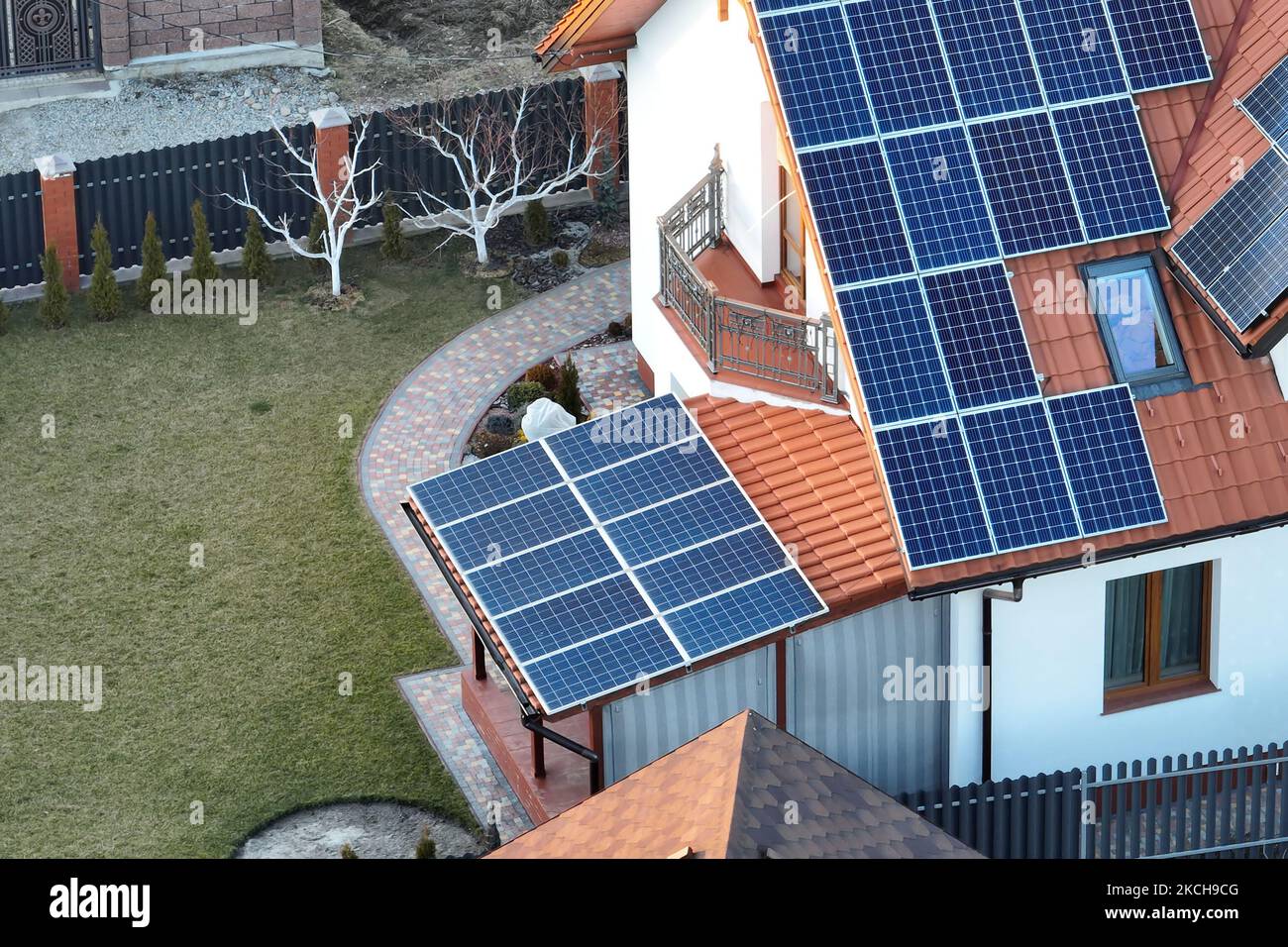 Residential house with rooftop covered with solar photovoltaic panels ...