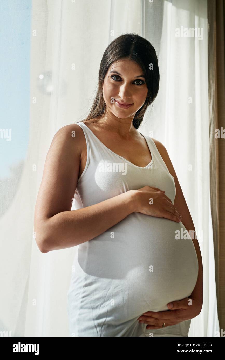 Woman smiling hand belly hi-res stock photography and images - Alamy
