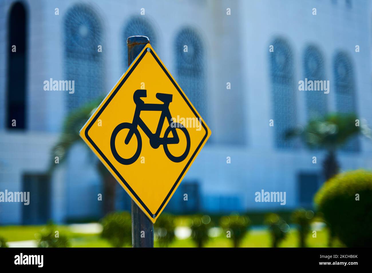 Diamond shaped sign with a bicycle. Alerting car drivers about a large ...