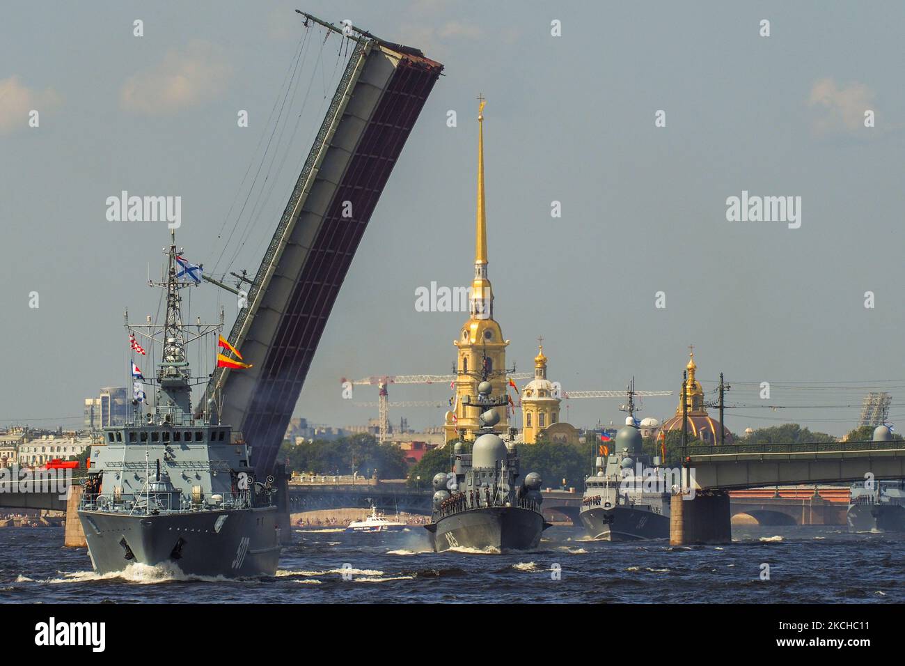 Warships parade on the Neva river past the Liteyny bridge during a Navy ...